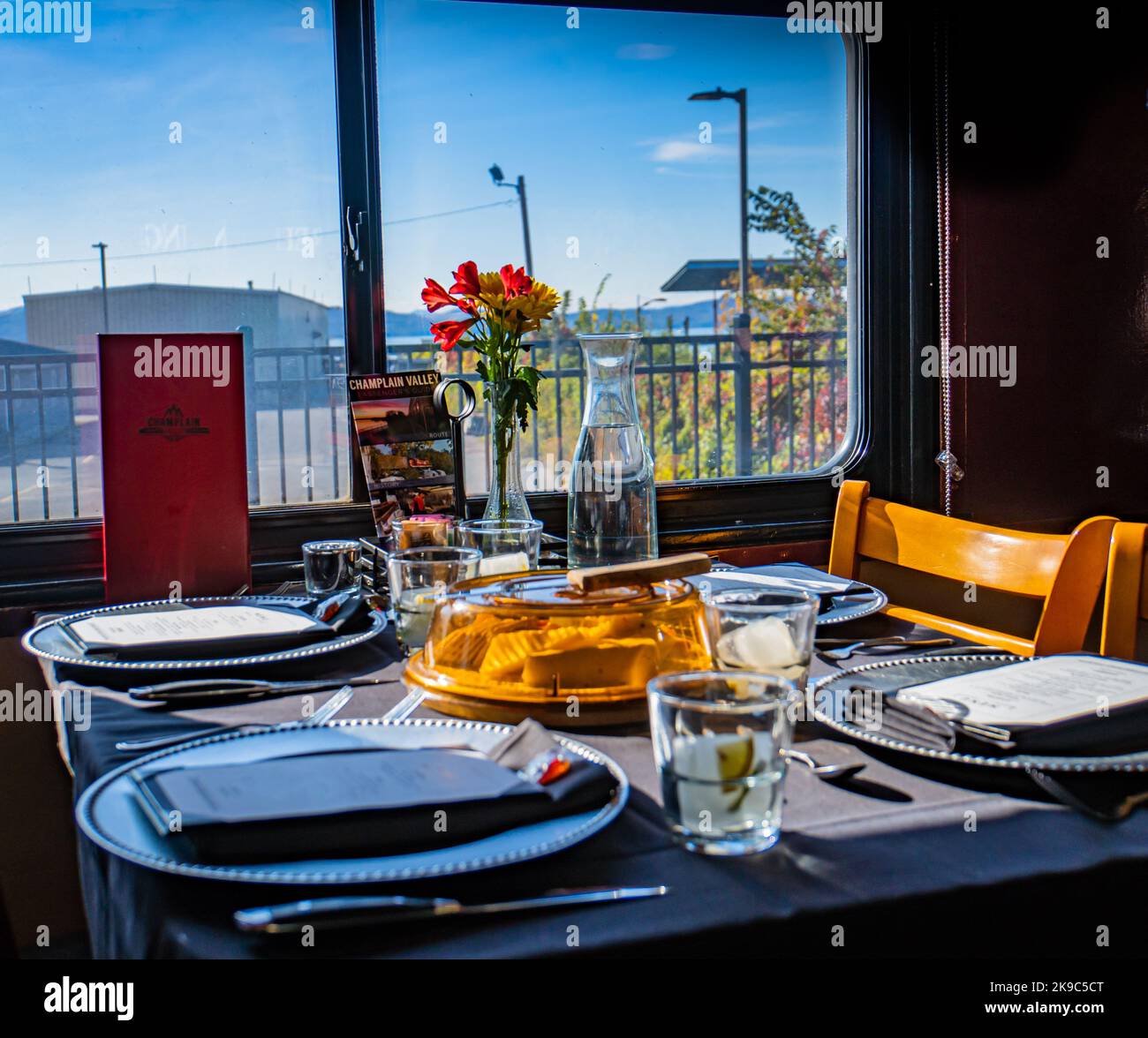 gourmet dinner served while beautiful Vermont landscape rolls by window ...