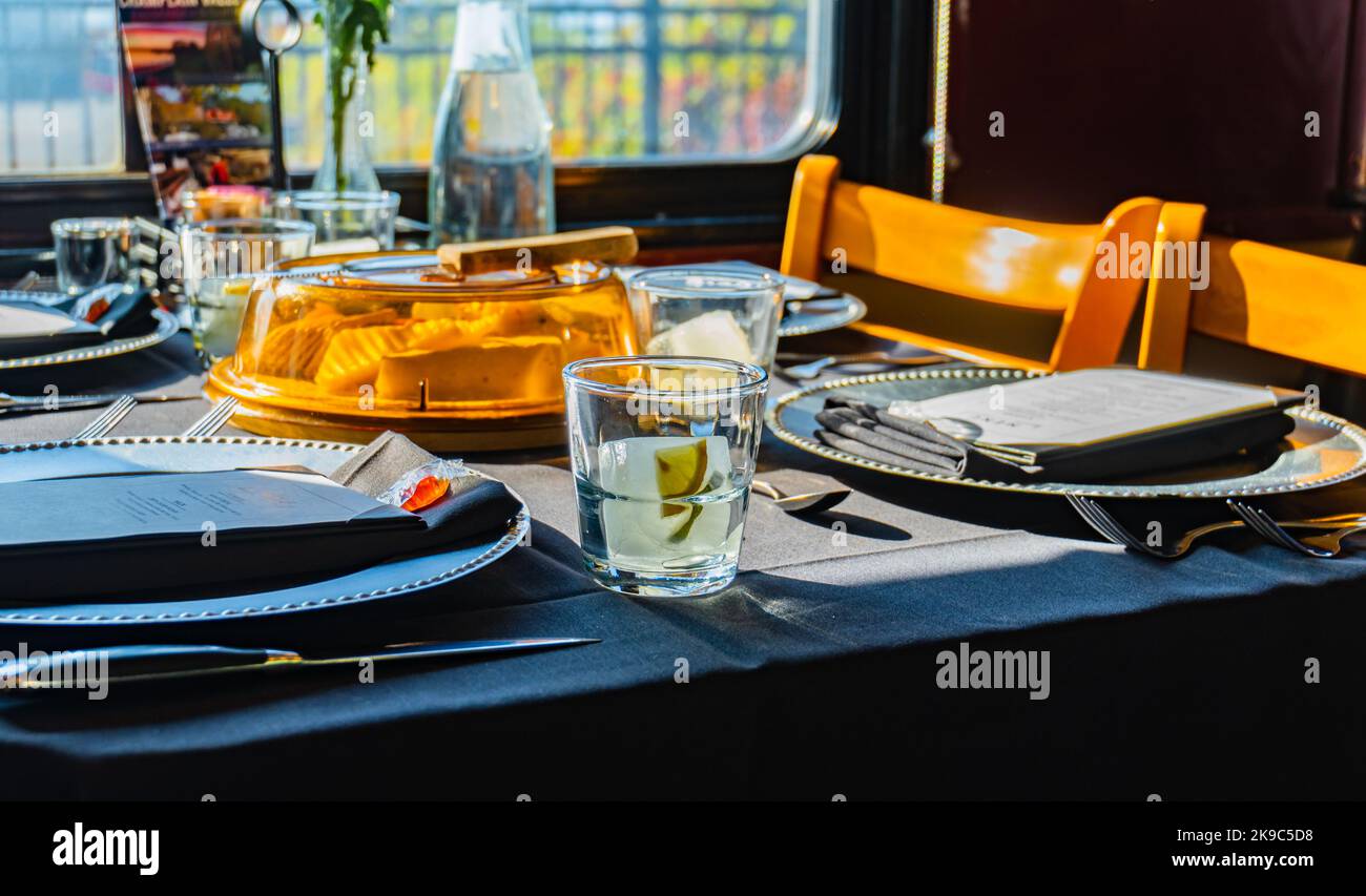 gourmet dinner served while beautiful Vermont landscape rolls by window ...