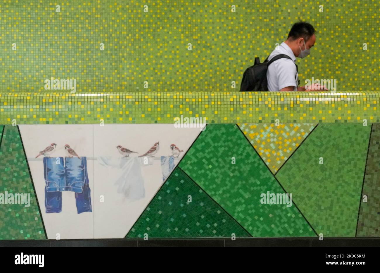 A man walks in the MTR Ho Man Tin Station. 18OCT22 SCMP / Sam Tsang ...