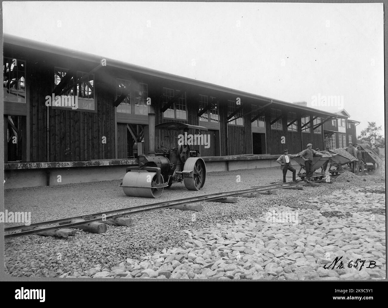 Steam roller and mining trolleys at the ground work to make the cargo ...