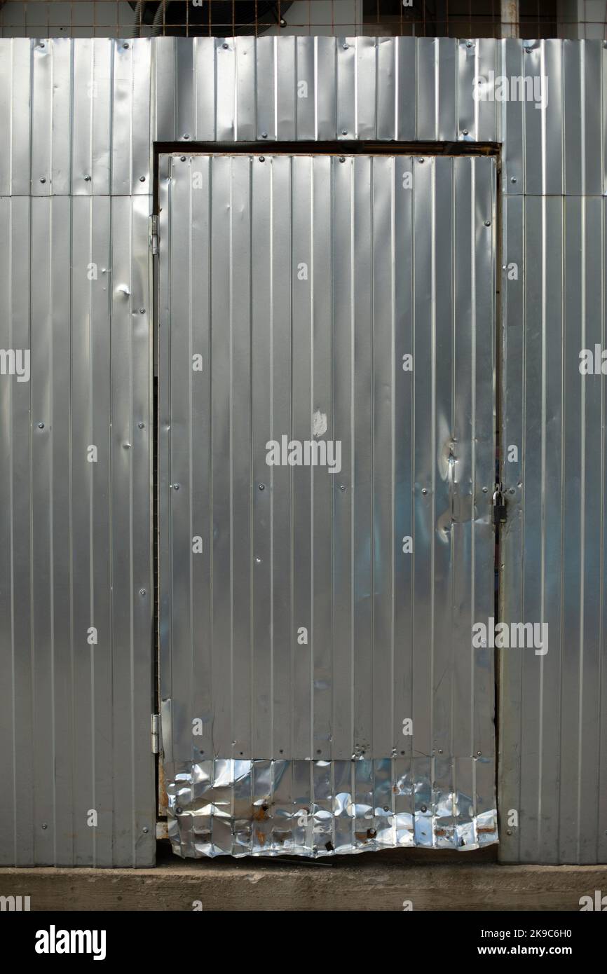 Crumpled metal. Broken door. Steel profile broken. Damaged wall Stock ...