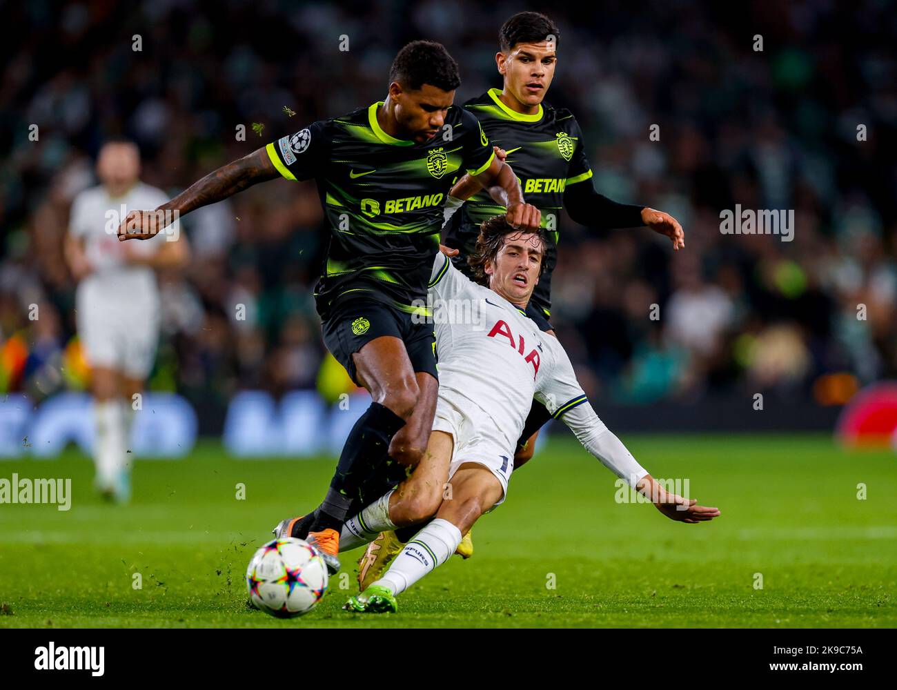 Tottenham Hotspur's Bryan Gil and Sporting Lisbon’s Matheus Reis battle ...