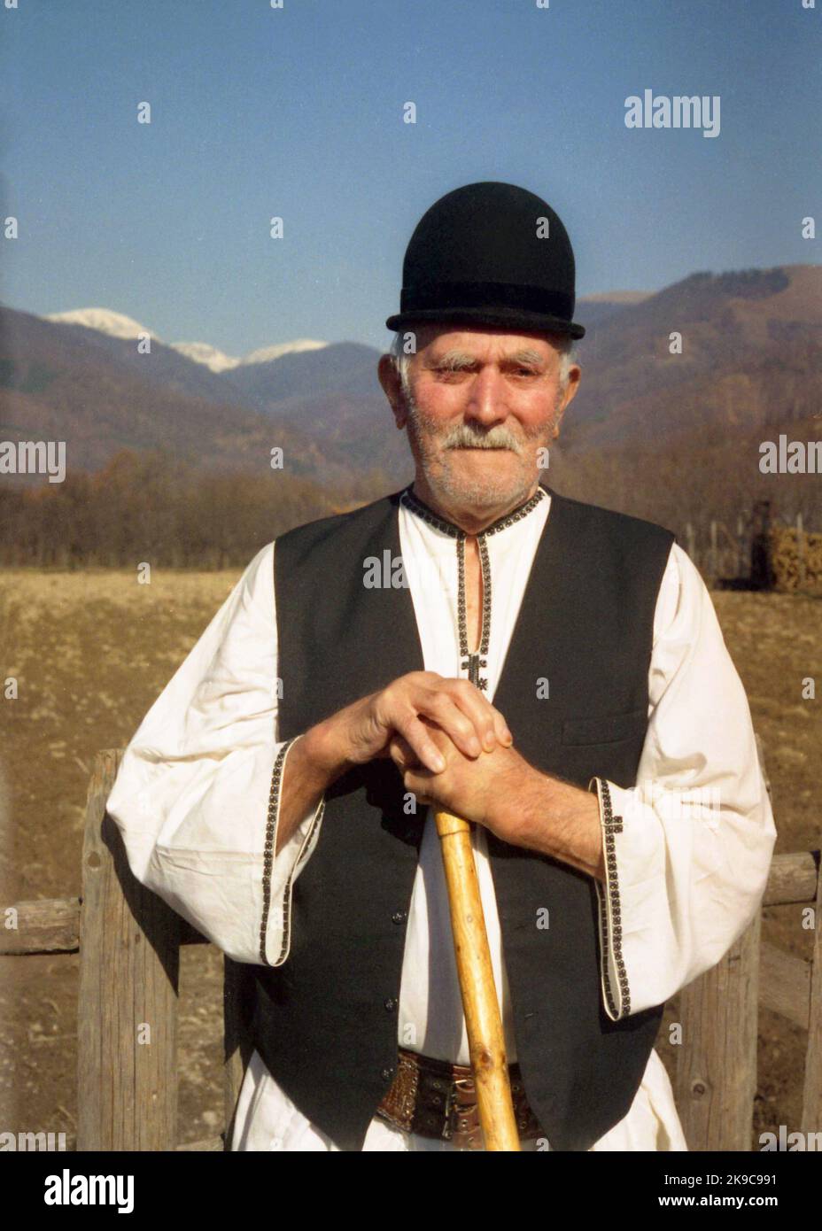 Gorj County, Romania, approx. 2000. Elderly man with cane in ...