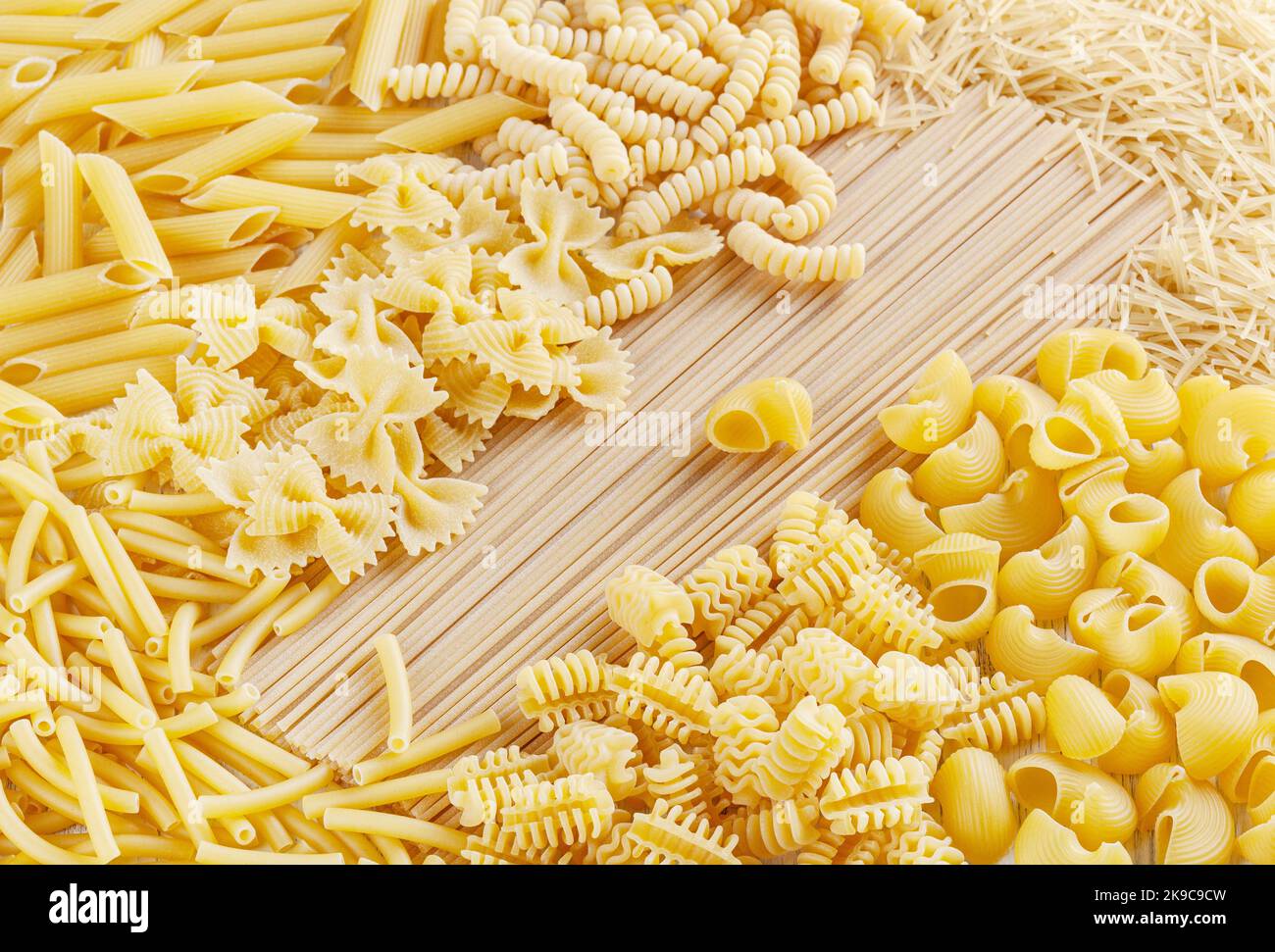 Different types and shapes of Italian pasta background Stock Photo - Alamy
