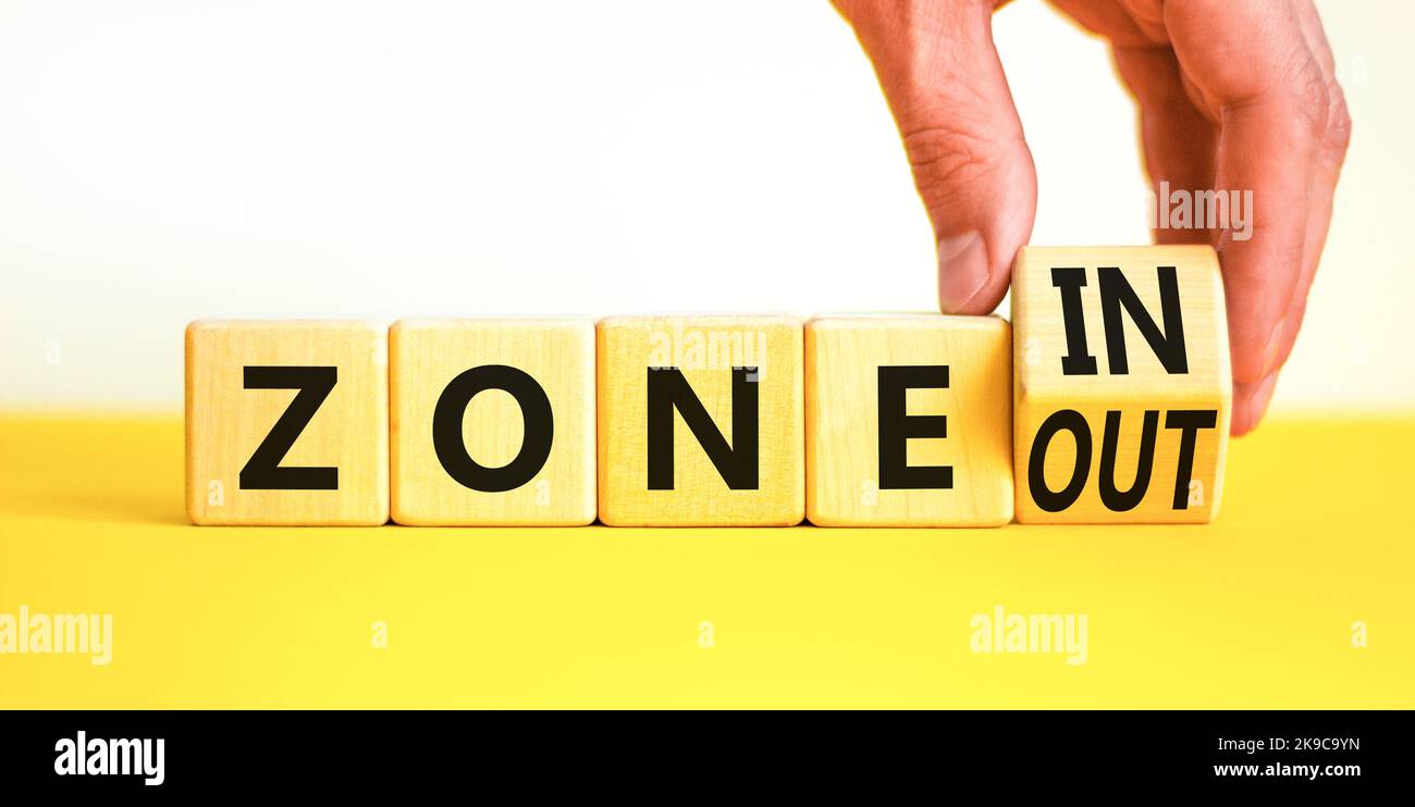 Zone in or out symbol. Concept words Zone in and Zone out on wooden ...