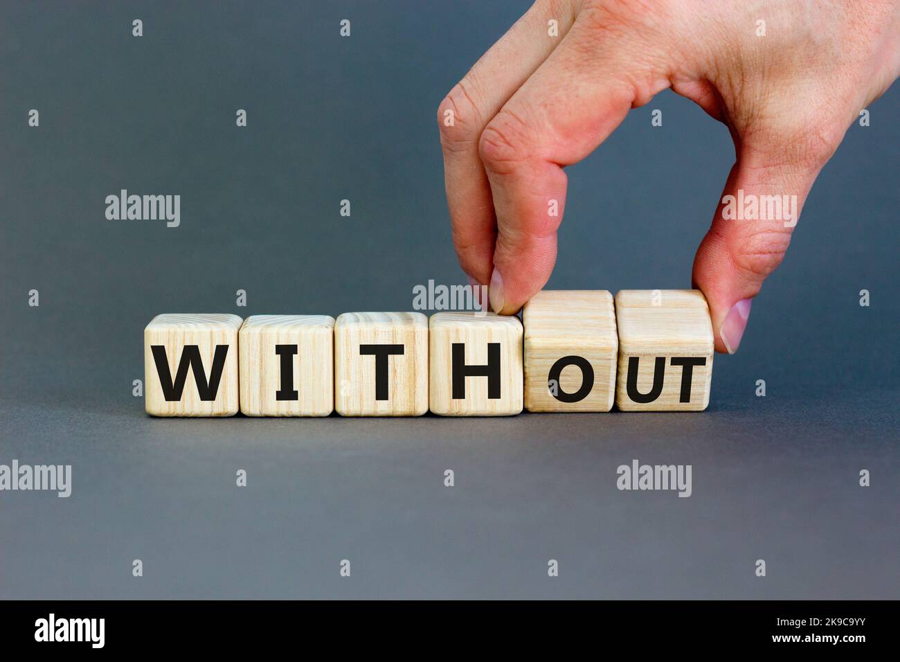 Without or with symbol. Concept words Without and With on wooden cubes ...