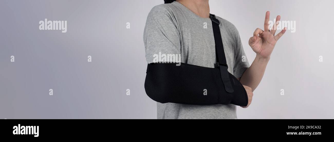 Broken arm. Arm Sling therapy support and covered around elbow first ...