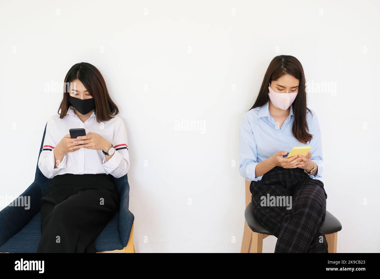 social distancing concept, Two women wearing masks and distancing while ...