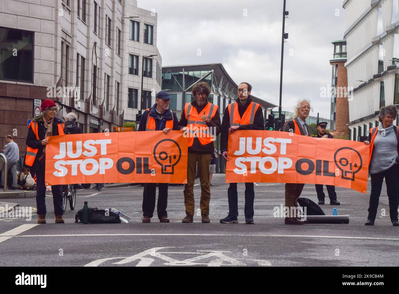 London, UK. 27th Oct, 2022. Protesters block the road with Just Stop ...