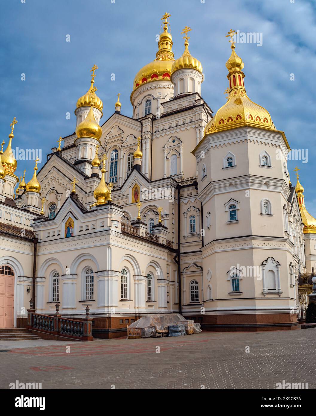 Majestic Christian Orthodox religious building. Arched windows, golden domes and crosses ...