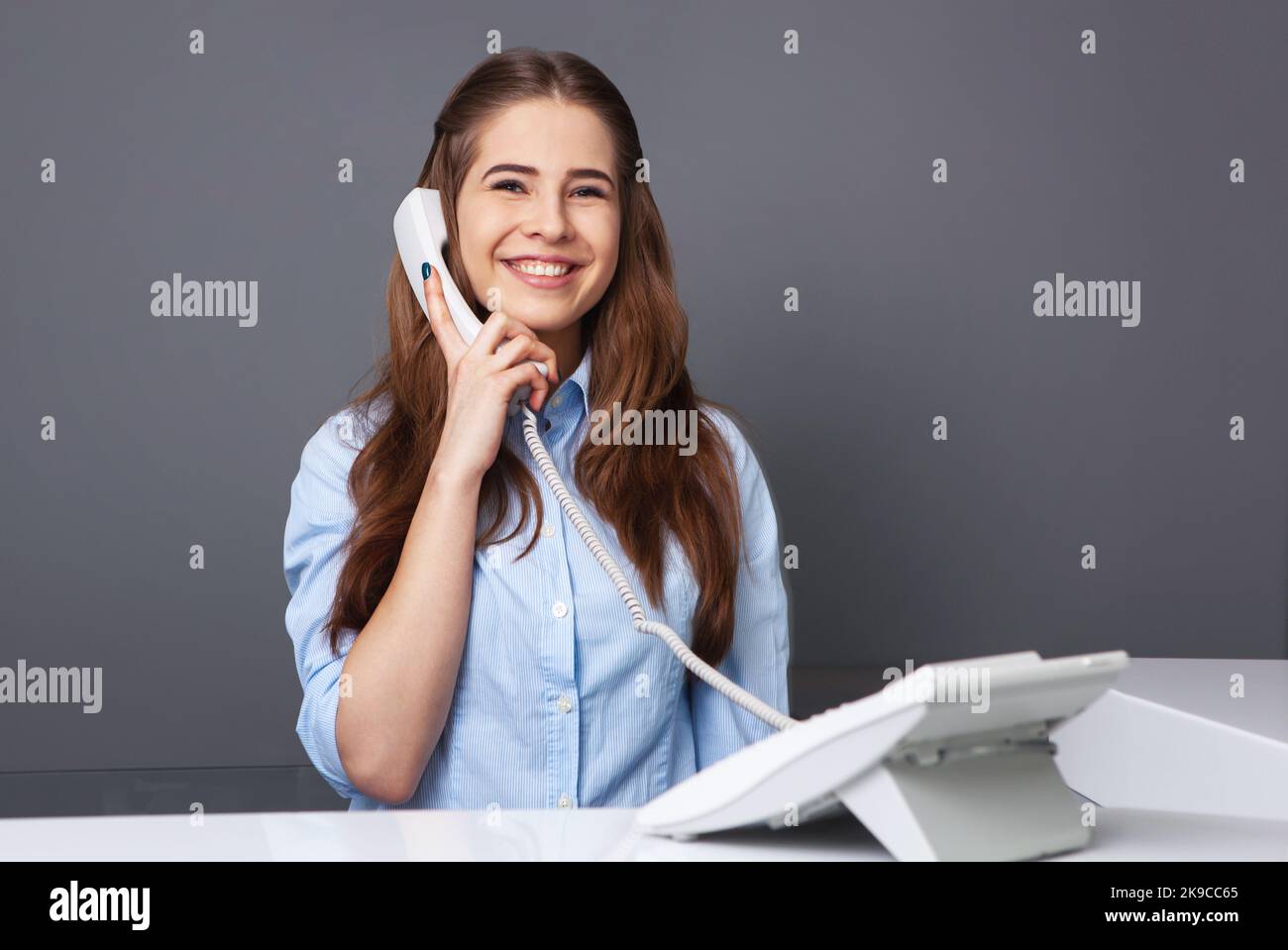 Woman smile receptionist portrait hi-res stock photography and images ...
