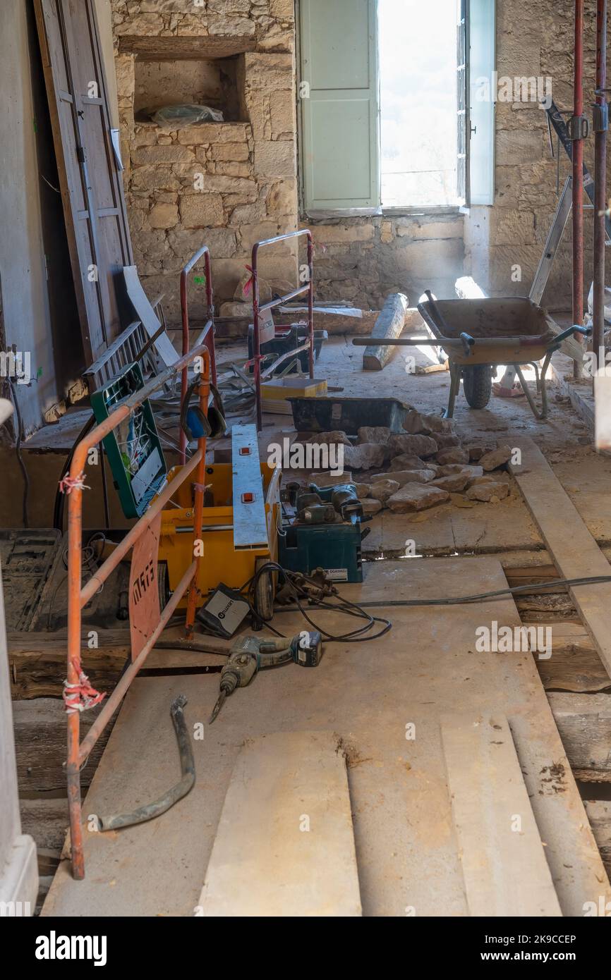 a builders work area and tools inside a medieval property restoration ...