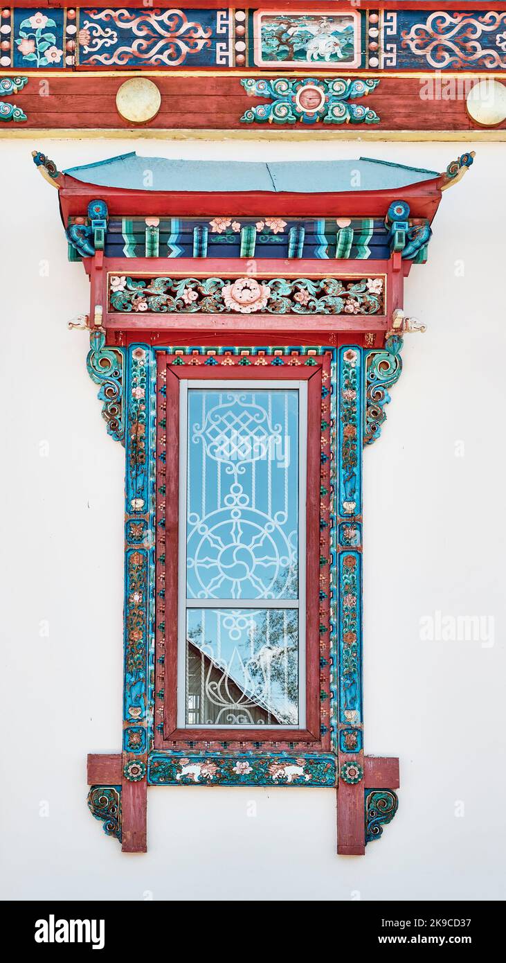 Cornice, old wooden window with platbands, with traditional colorful ...