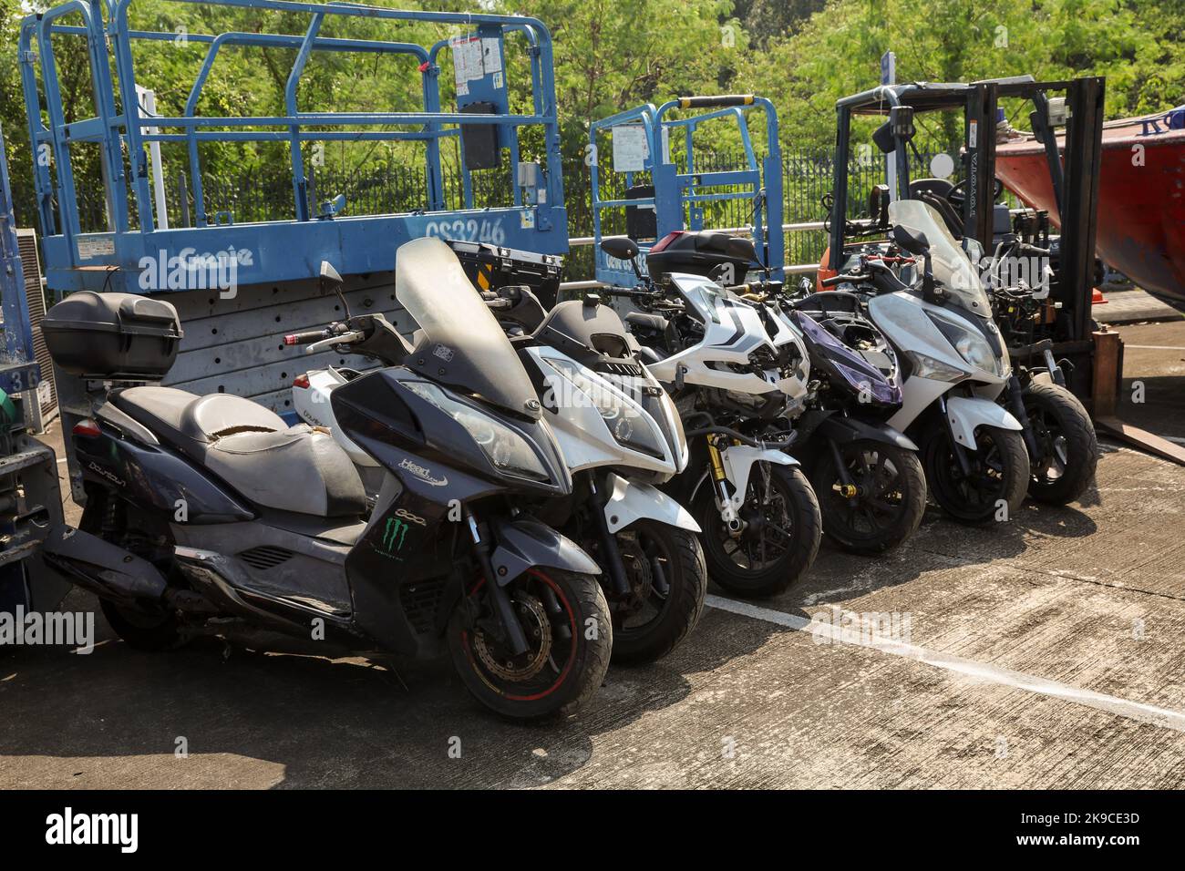 Six motorcycles which were seized in an operation are displayed in a ...