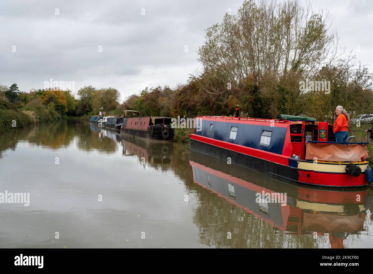Colourful narrow boats and barges moored on the Kennet and Avon Canal ...