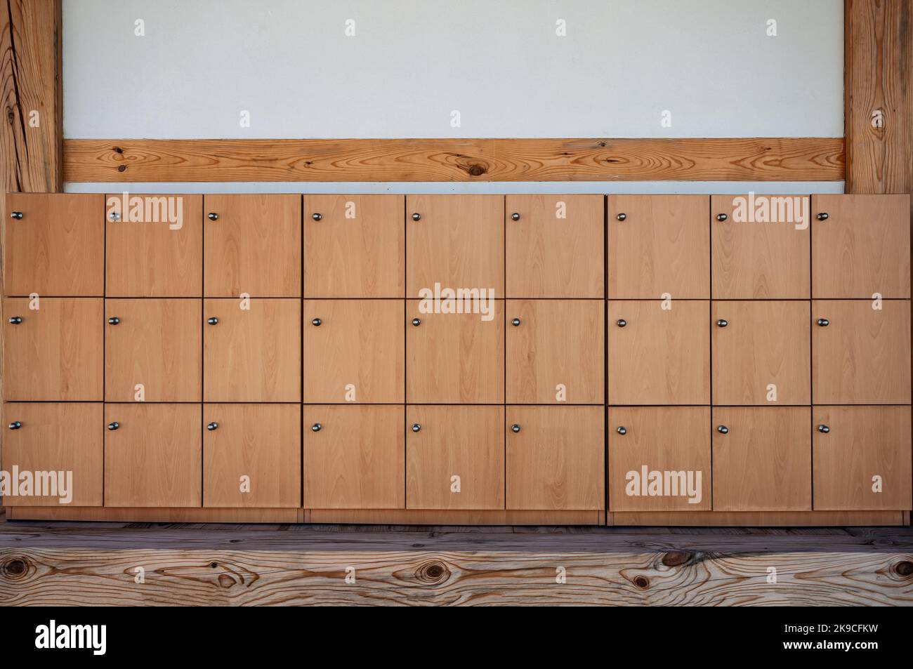 Wooden brown square cabinet storage locker with handle Stock Photo - Alamy