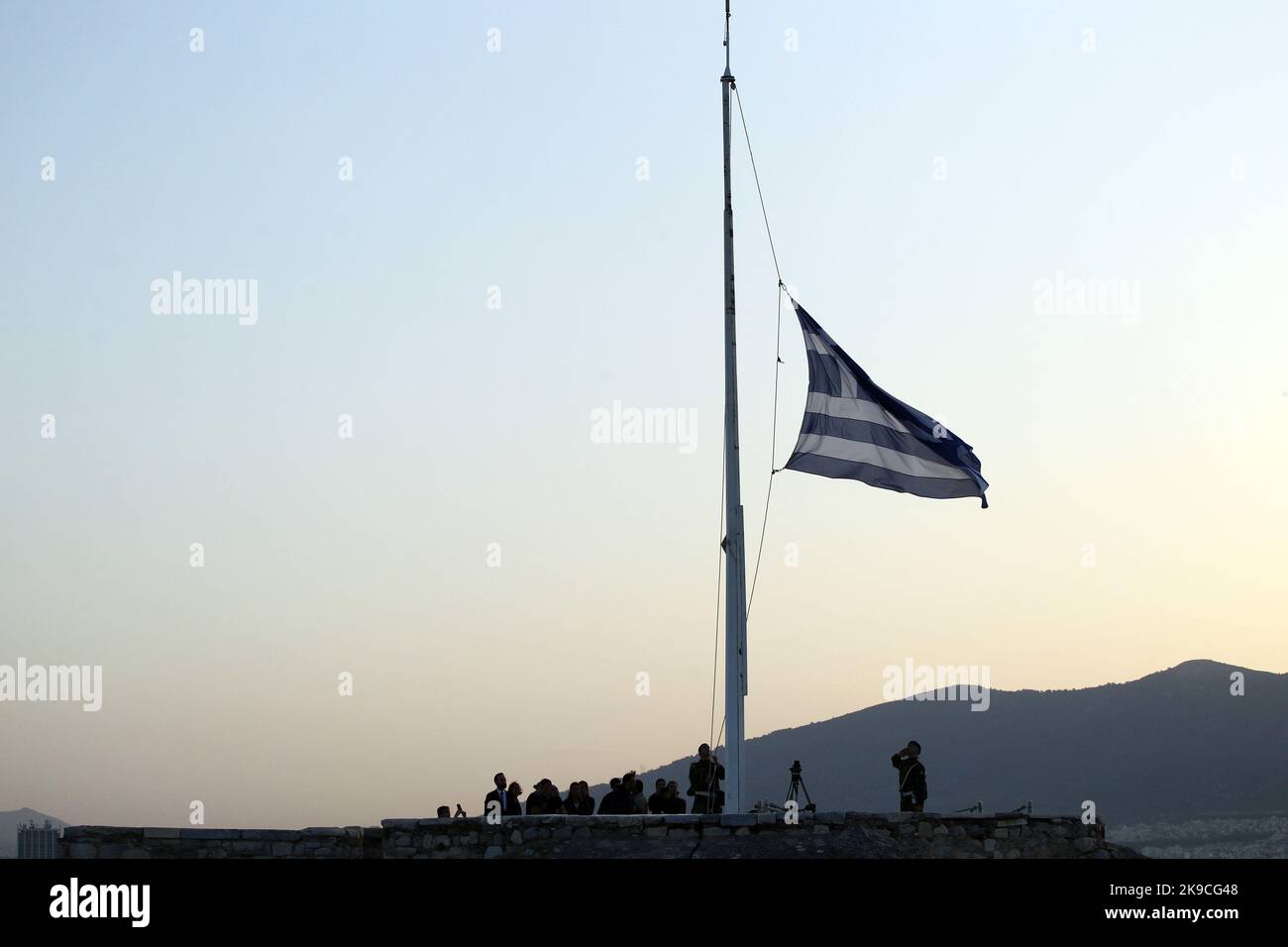 flag raising on the hill of Acropolis Stock Photo - Alamy
