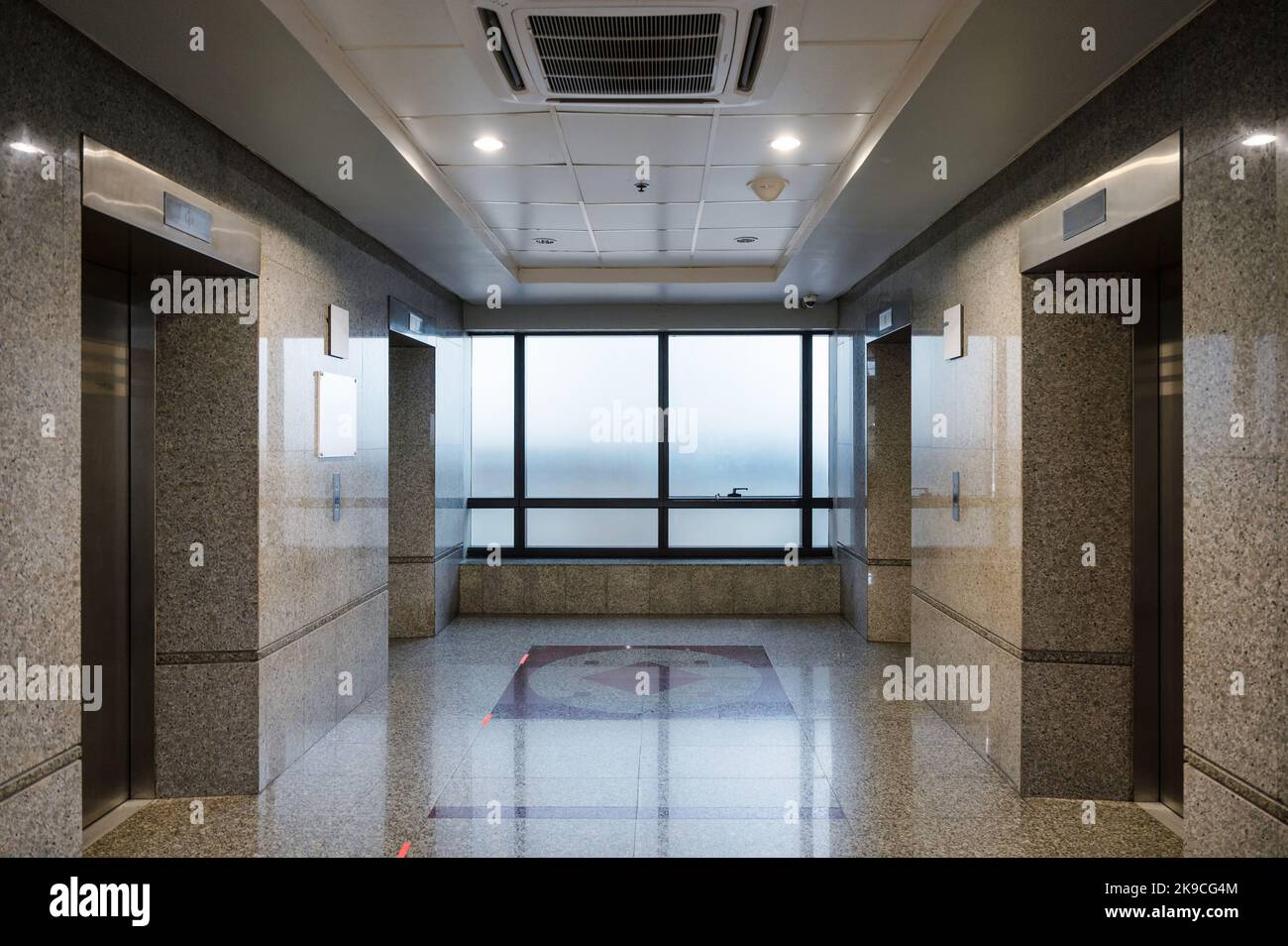 Interior of closed marble elevator hall in the office Stock Photo - Alamy