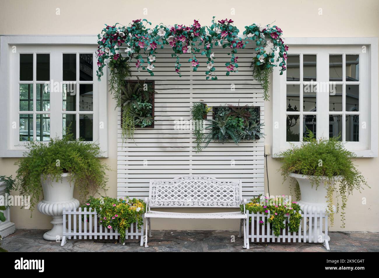 Backdrop of wall and windows decorate with ornamental plants and lath ...
