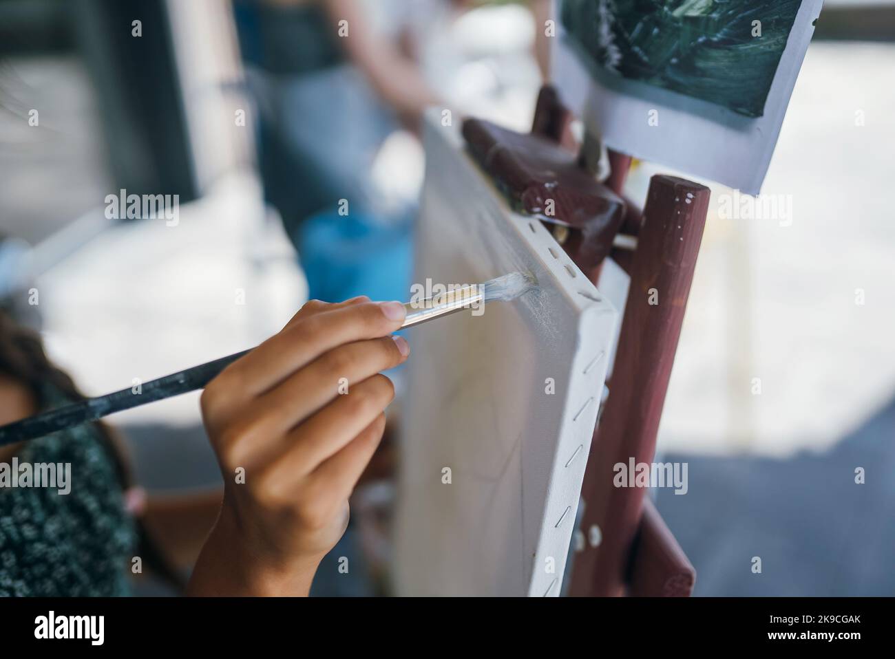Woman drawing her picture on canvas with oil colors Stock Photo - Alamy