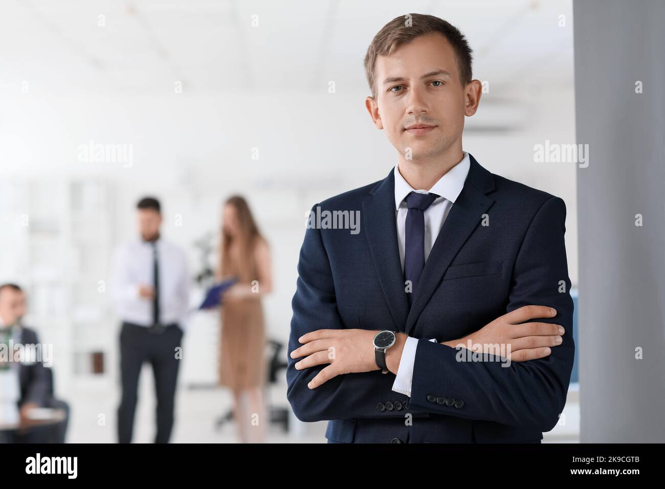 Young bank manager working in office Stock Photo - Alamy