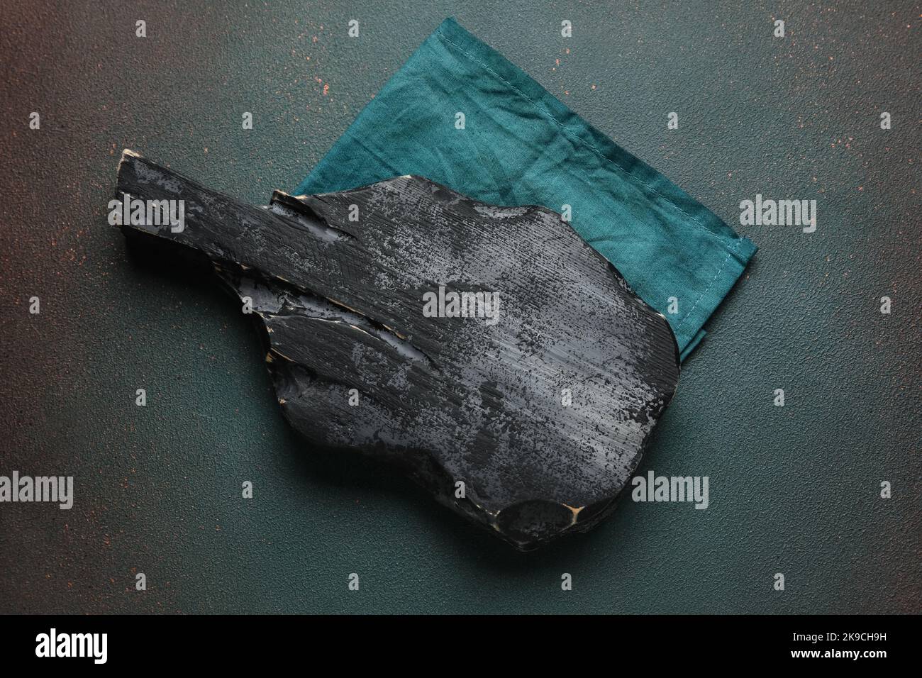 Black wooden cutting board and napkin on dark background Stock Photo ...