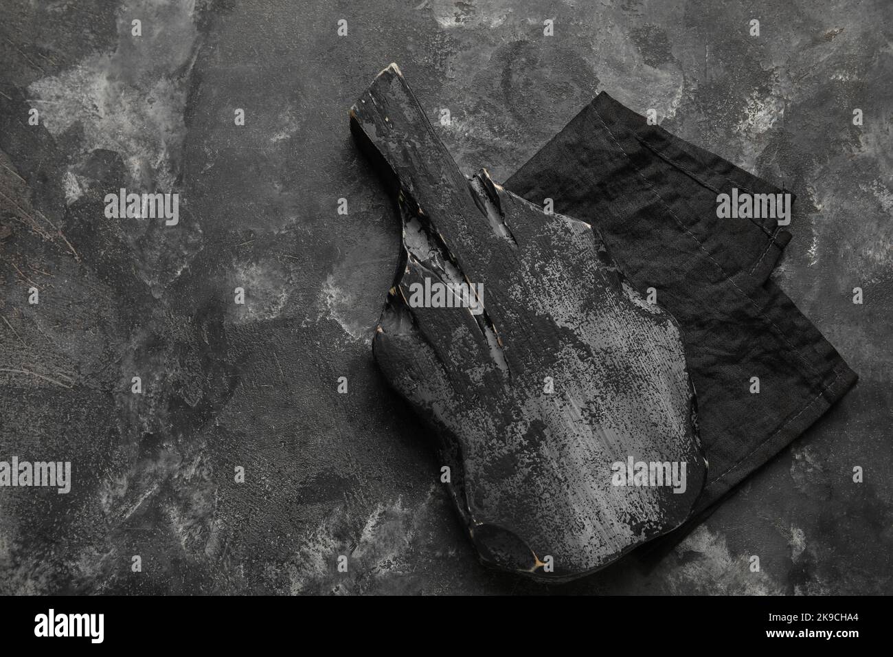 Black wooden cutting board and napkin on dark background Stock Photo ...