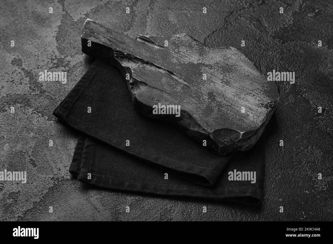 Black wooden cutting board with napkin on dark background Stock Photo ...