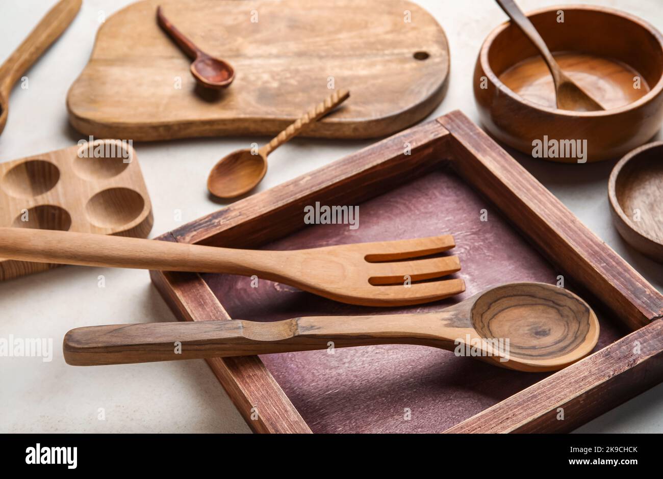 Wooden cooking utensils on white background Stock Photo - Alamy
