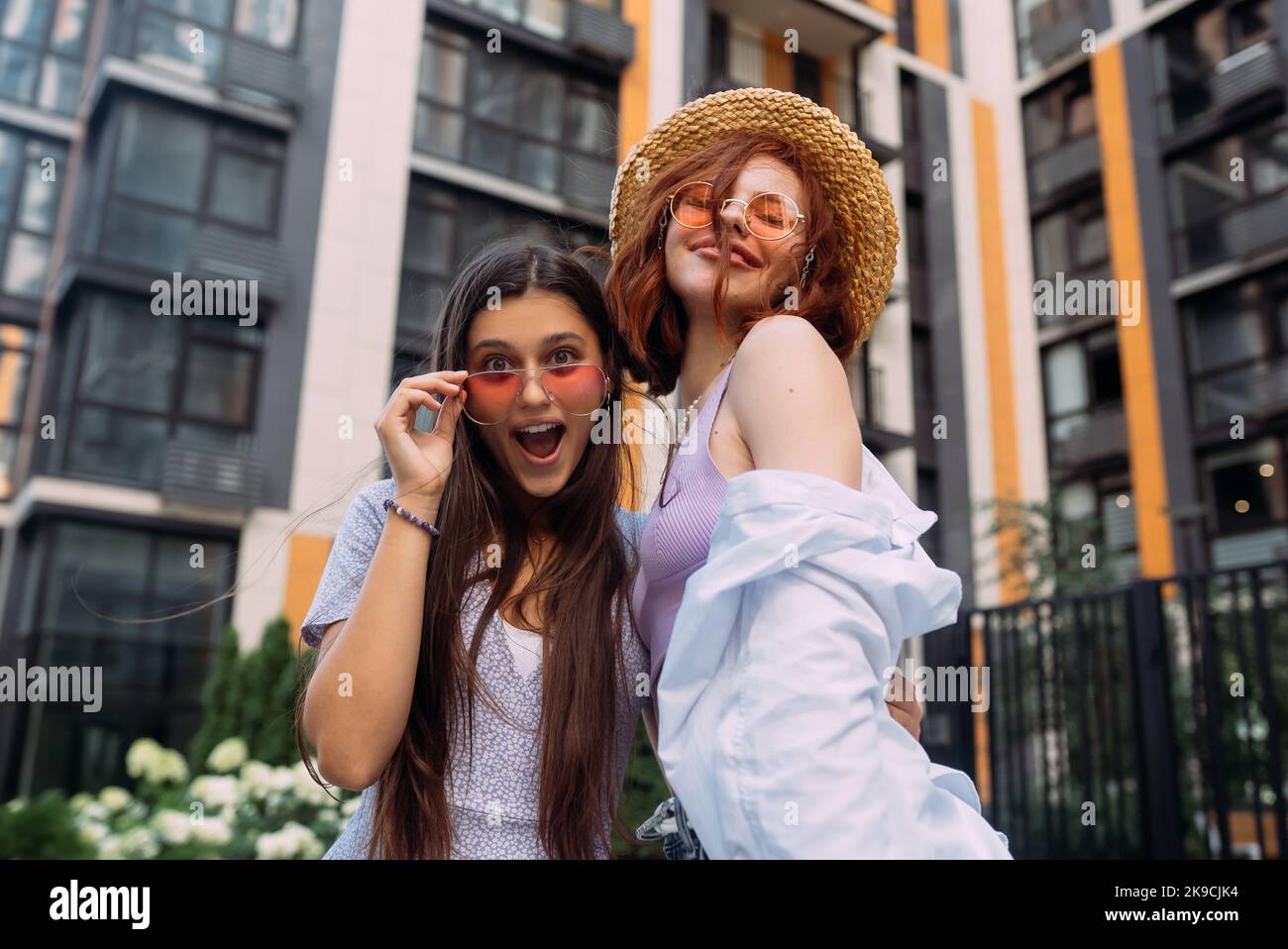 Two lovely girl friends hugging and having fun Stock Photo - Alamy