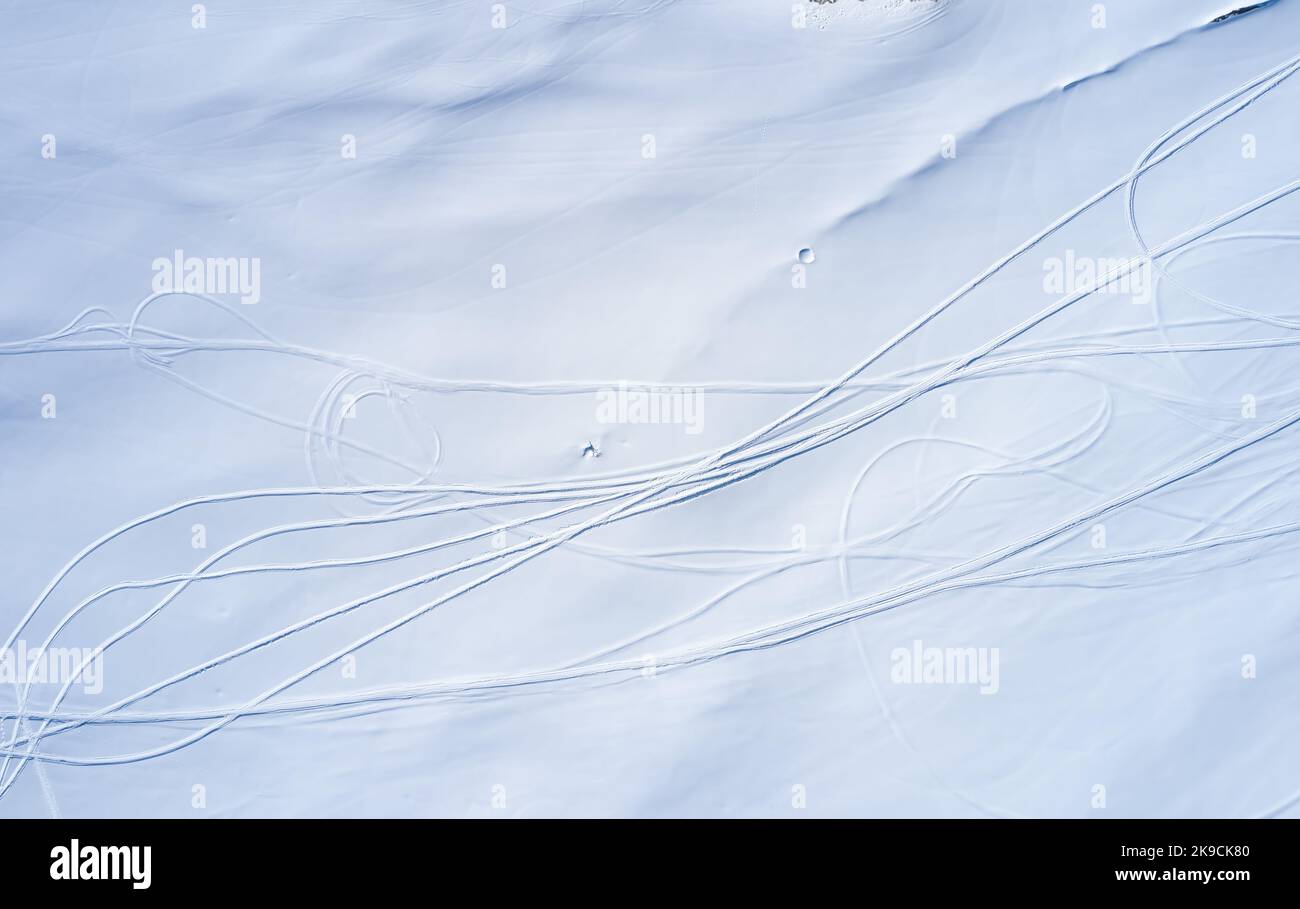 Abstract snow surface background with snowmobile tracks Stock Photo - Alamy