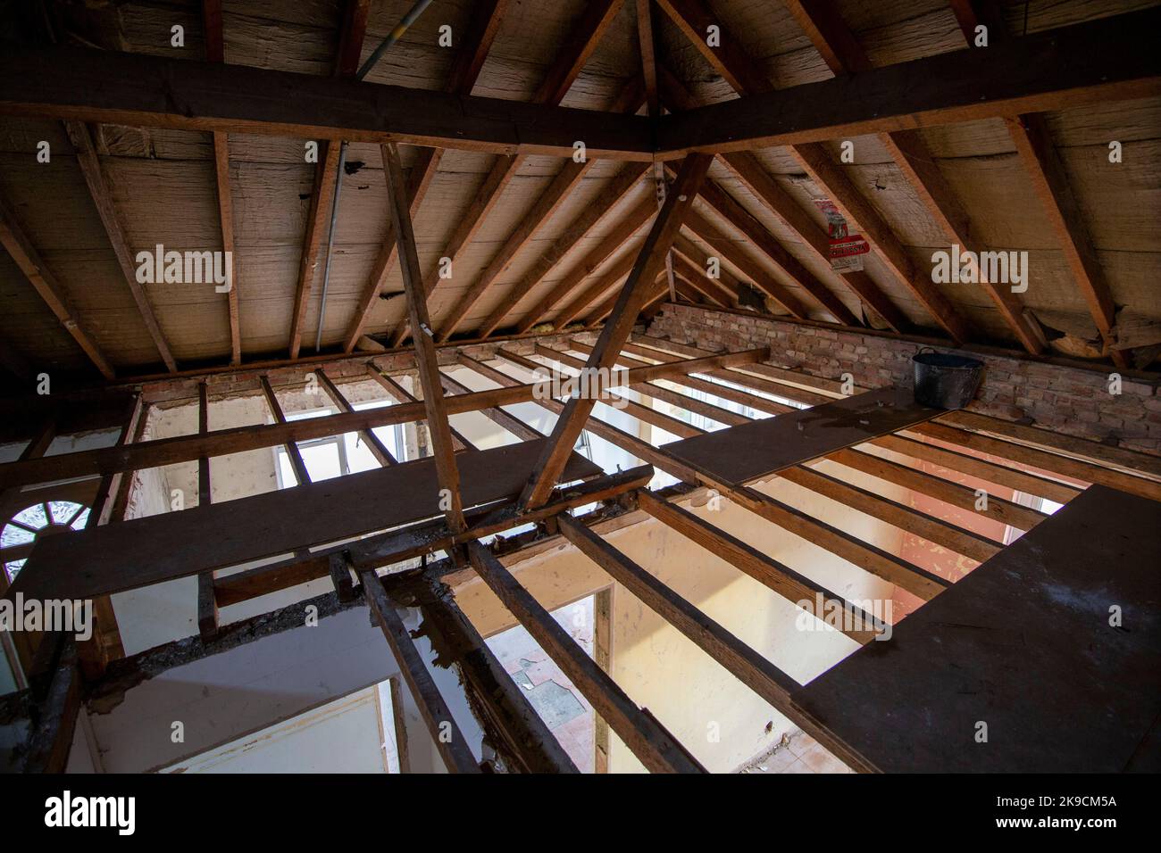 Exposed roof rafters in house for renovation Stock Photo - Alamy