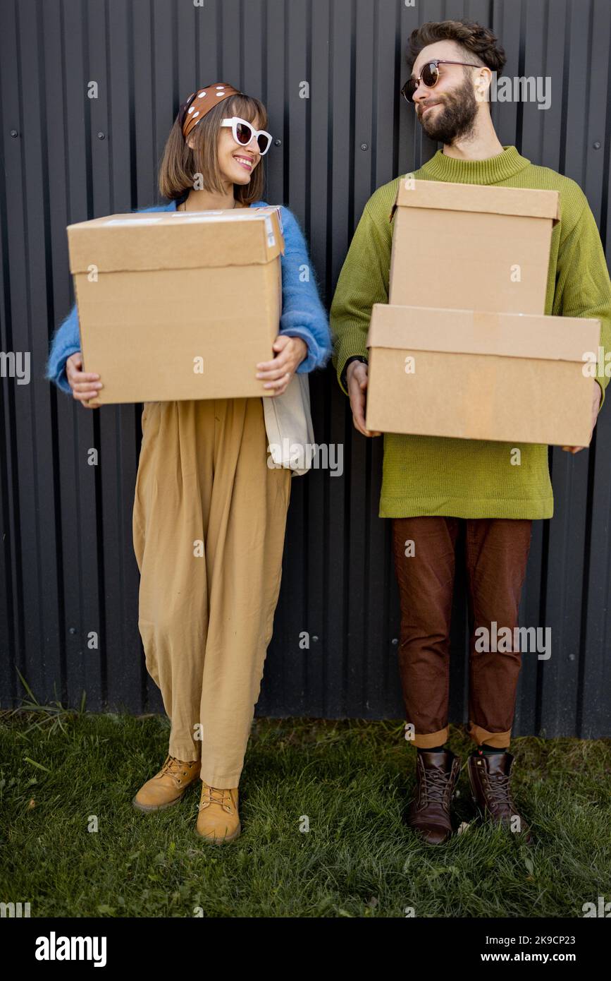 Delivery man holding package parcels hi-res stock photography and ...