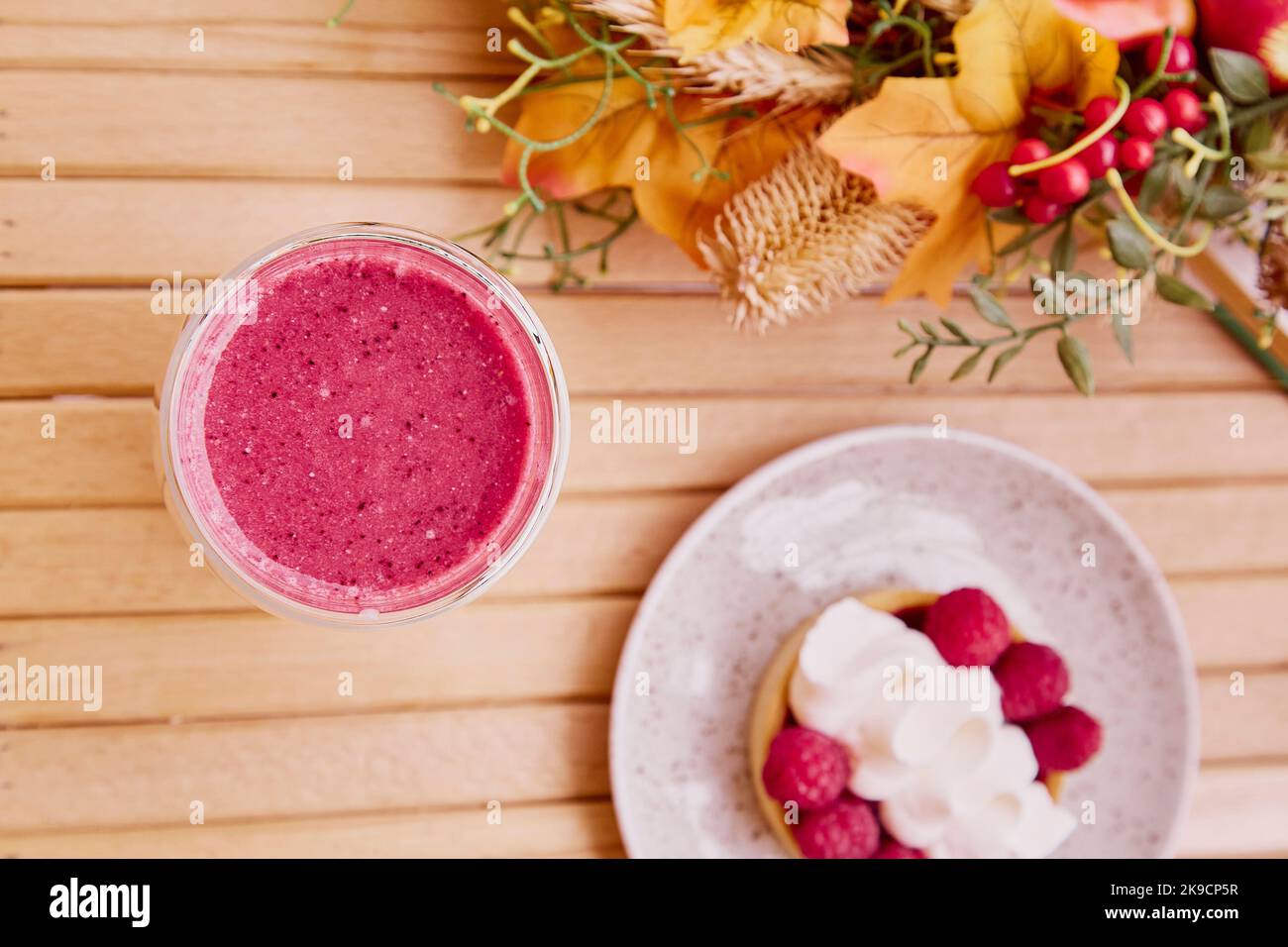 Healthy pink raspberry smoothie with french tart with autumn ...