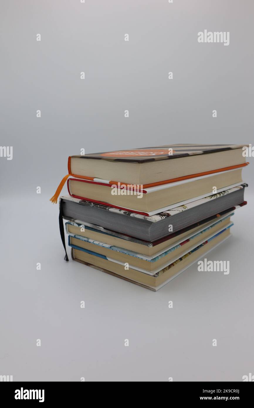 Pile of books on a white background with copy space Stock Photo - Alamy