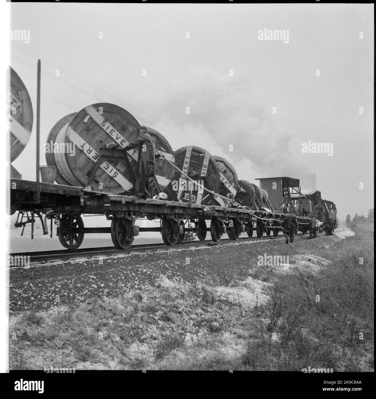 Cable output train. Plusing telecommunications in the embankment before ...