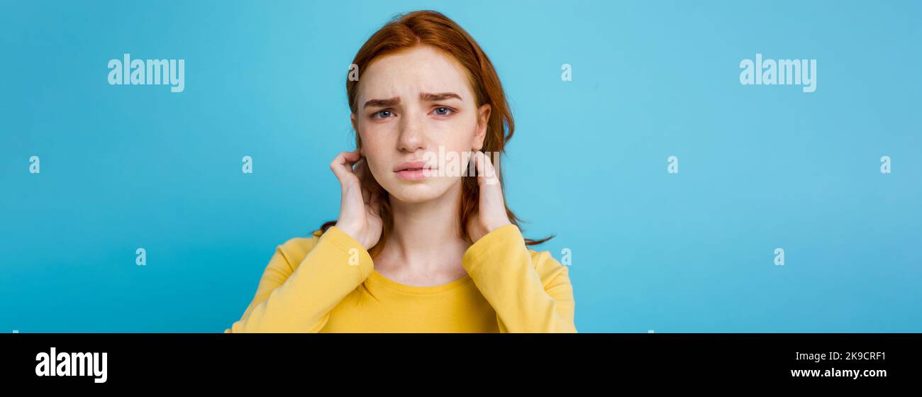 Headshot Portrait of tender redhead teenage girl with serious ...