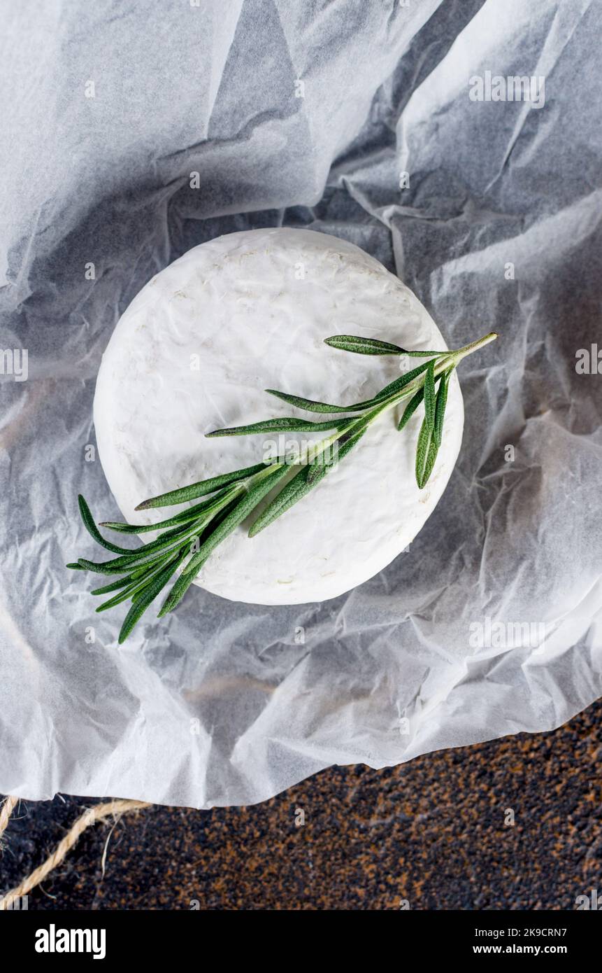 Camembert cheese close-up with honey, walnuts, vine. Dinner or aperitif ...