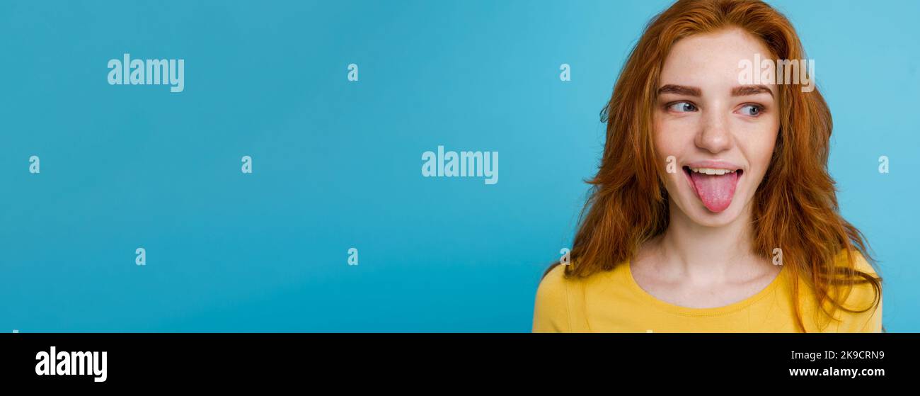 Headshot Portrait of happy ginger red hair girl with funny face looking ...
