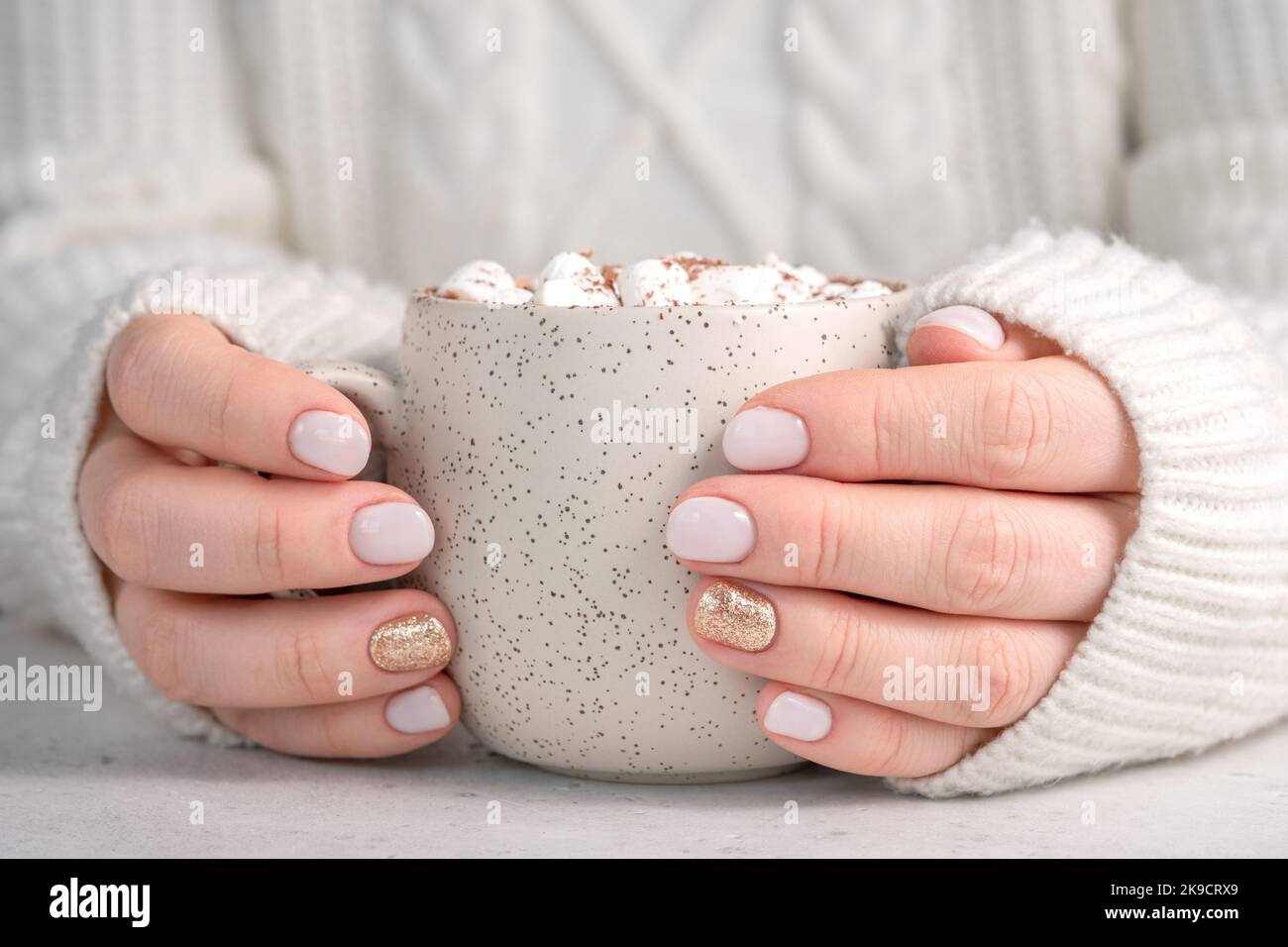 female hand holding cup of hot cocoa Stock Photo - Alamy