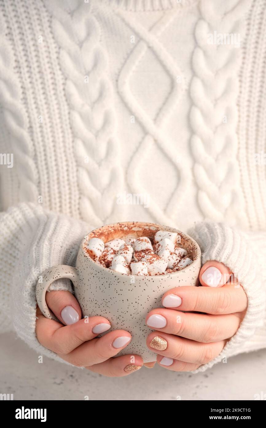 female hand holding cup of hot cocoa Stock Photo - Alamy