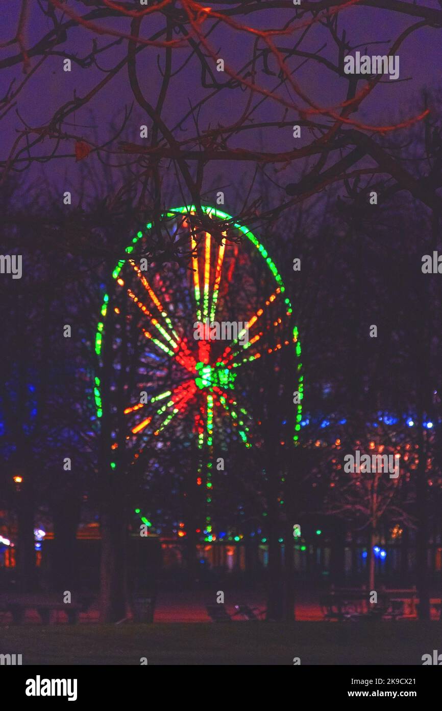 Blurry photo of Christmas market at Tuileries Garden with colorful ...