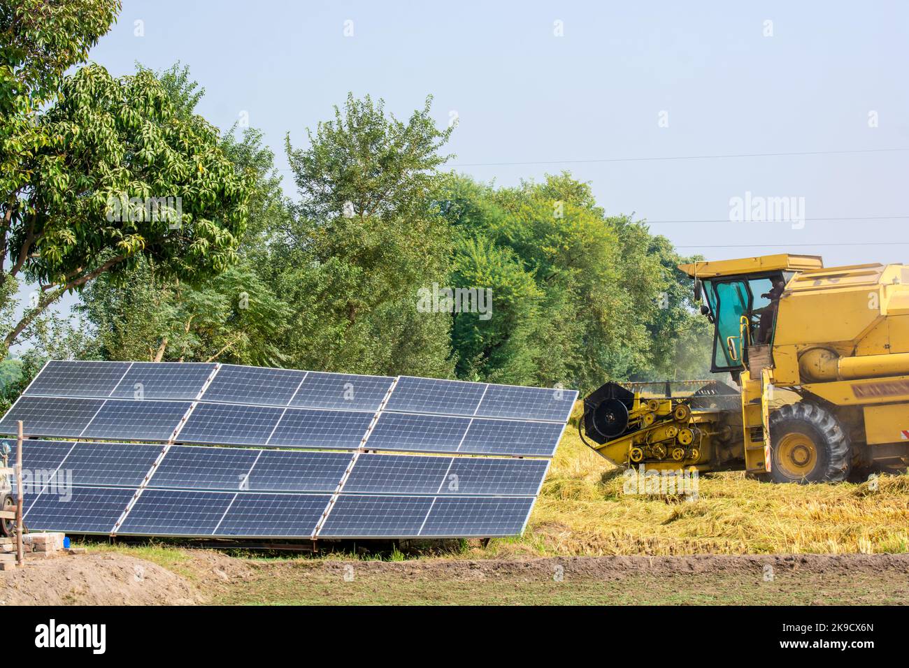 Solar panels for irrigation on the farmland on the other side Combine ...