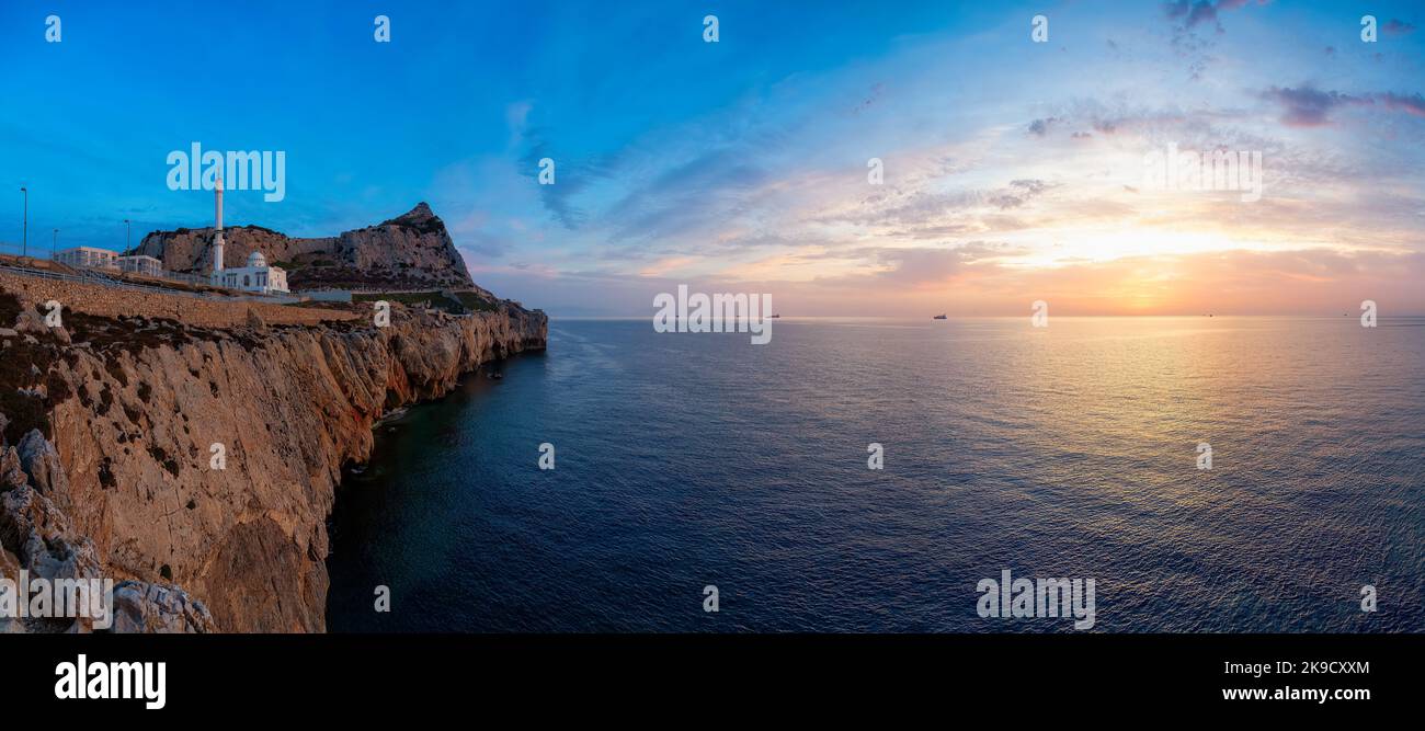 Europa Point Lighthouse with sea in background. Colorful Cloudy Sunrise ...