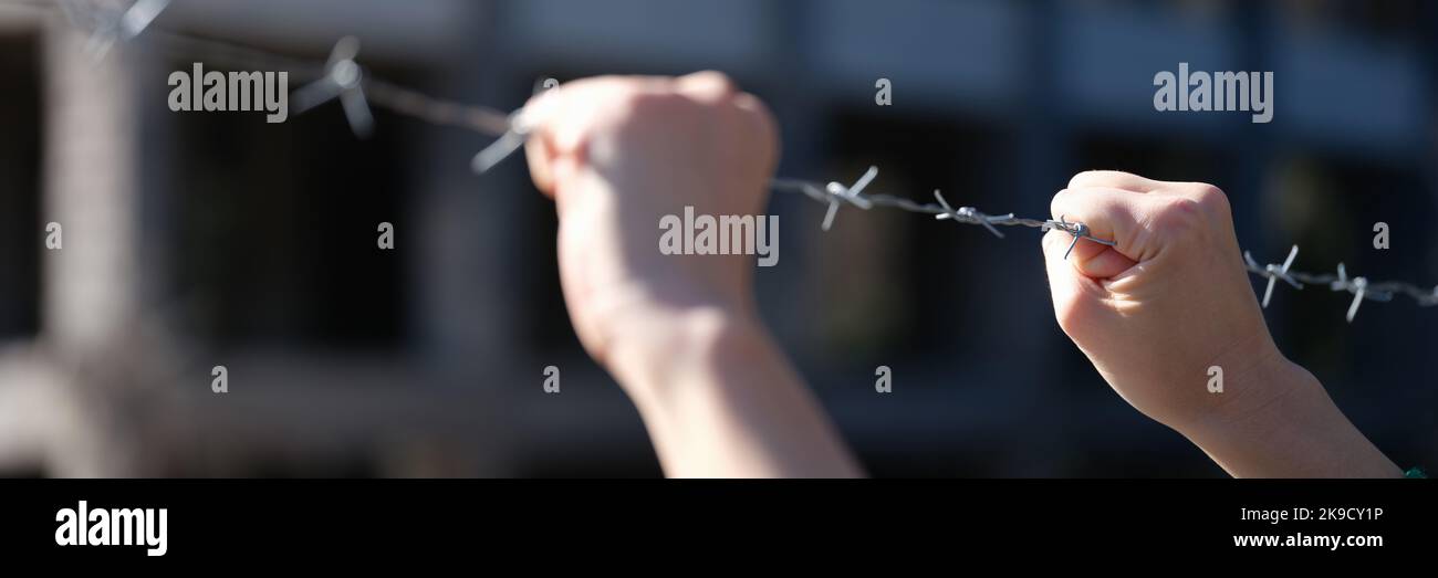 Hand with barbed wire hi-res stock photography and images - Alamy