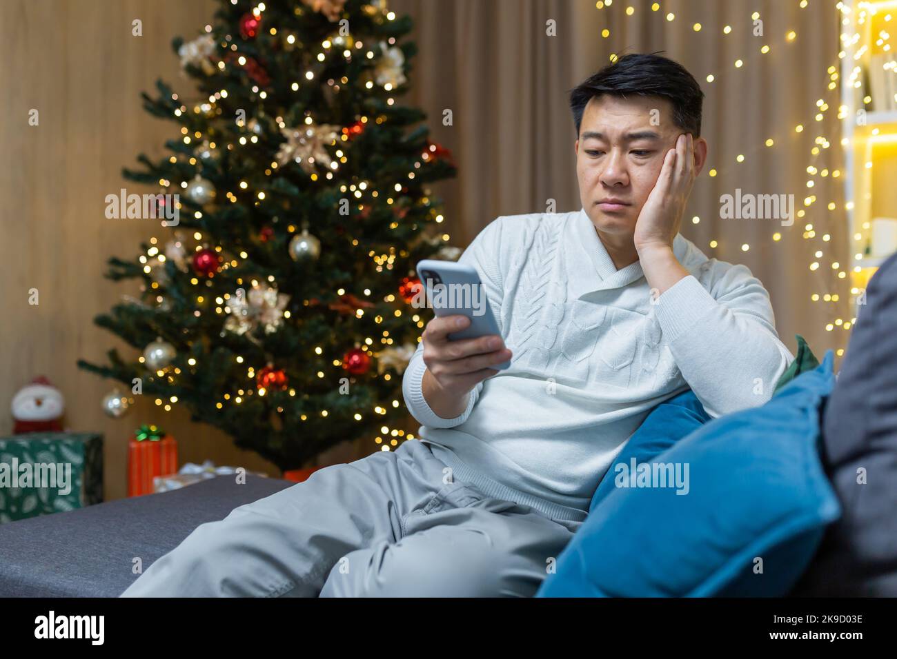 Worried asian man read bad news message notification on new year ...