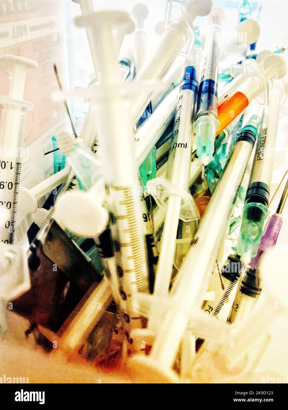 Used needles in a pile. Drug waste and hypodermic needles Stock Photo ...