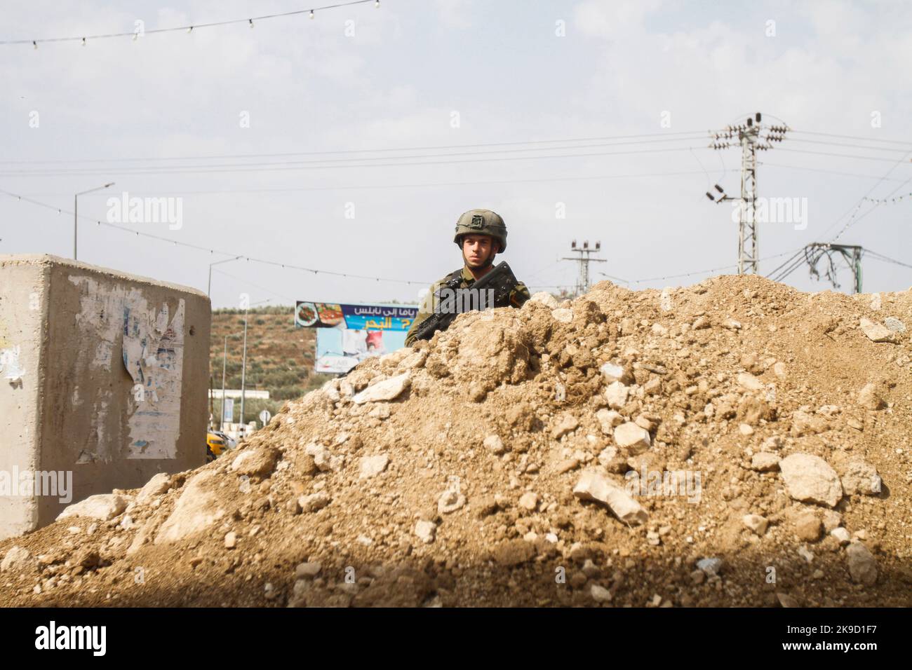 Nablus, Palestine. 26th Oct, 2022. An Israeli soldier seen guarding a ...