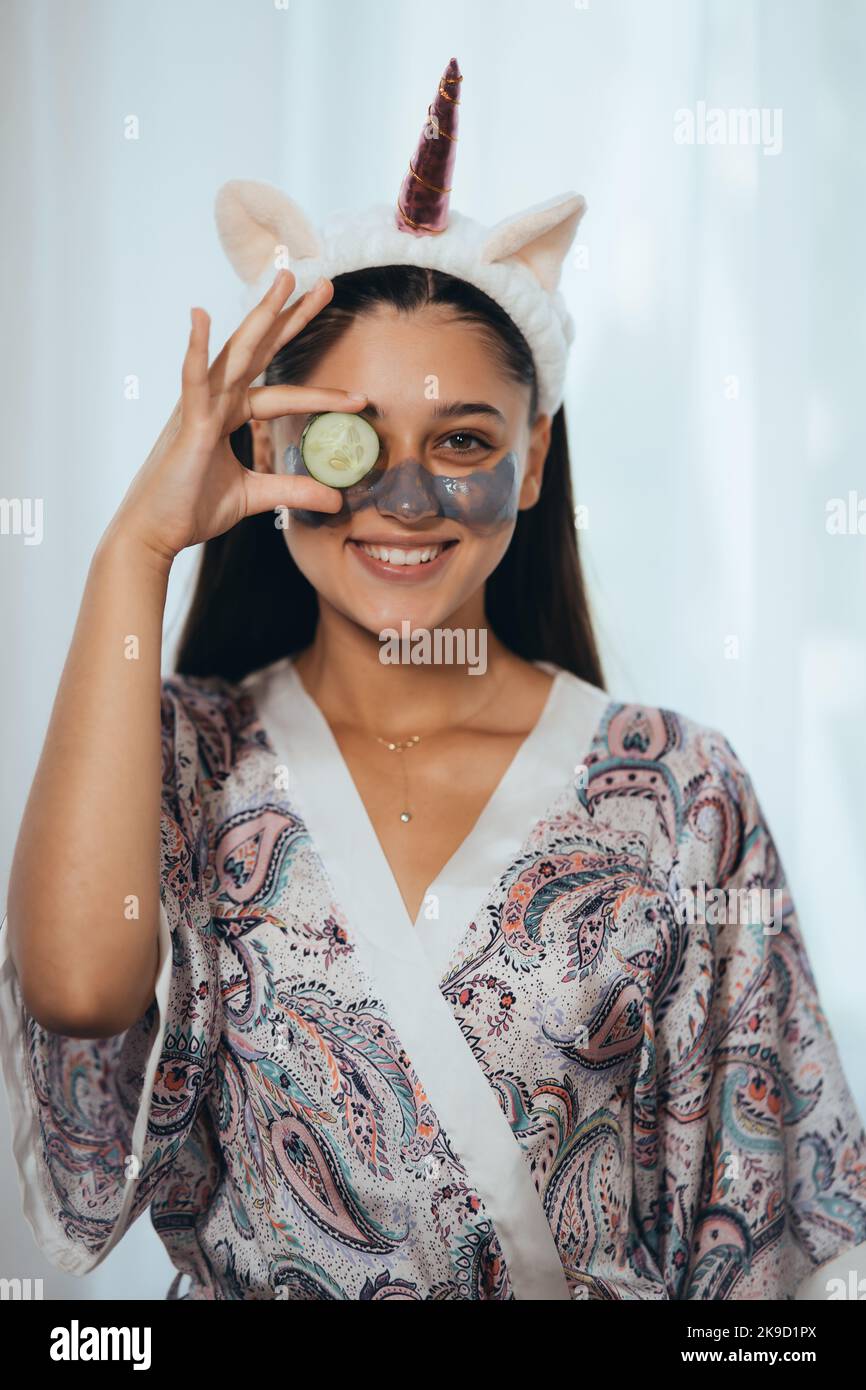 Funny smiling Spa Woman with fresh Facial Mask hold cucumber Stock ...