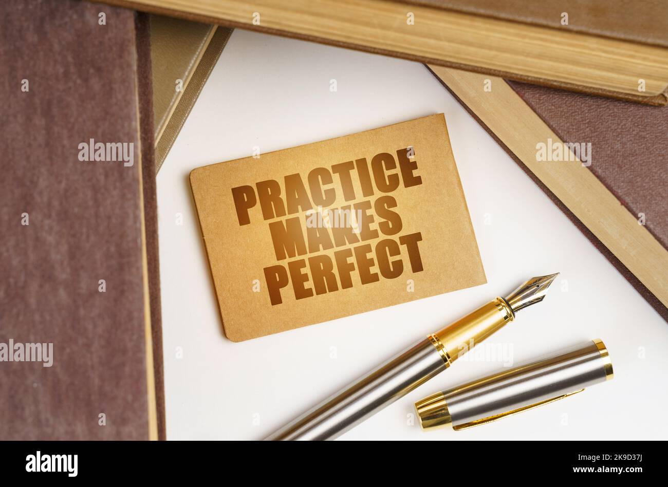 Education and business concept. Next to the books lies a pen and a sign ...